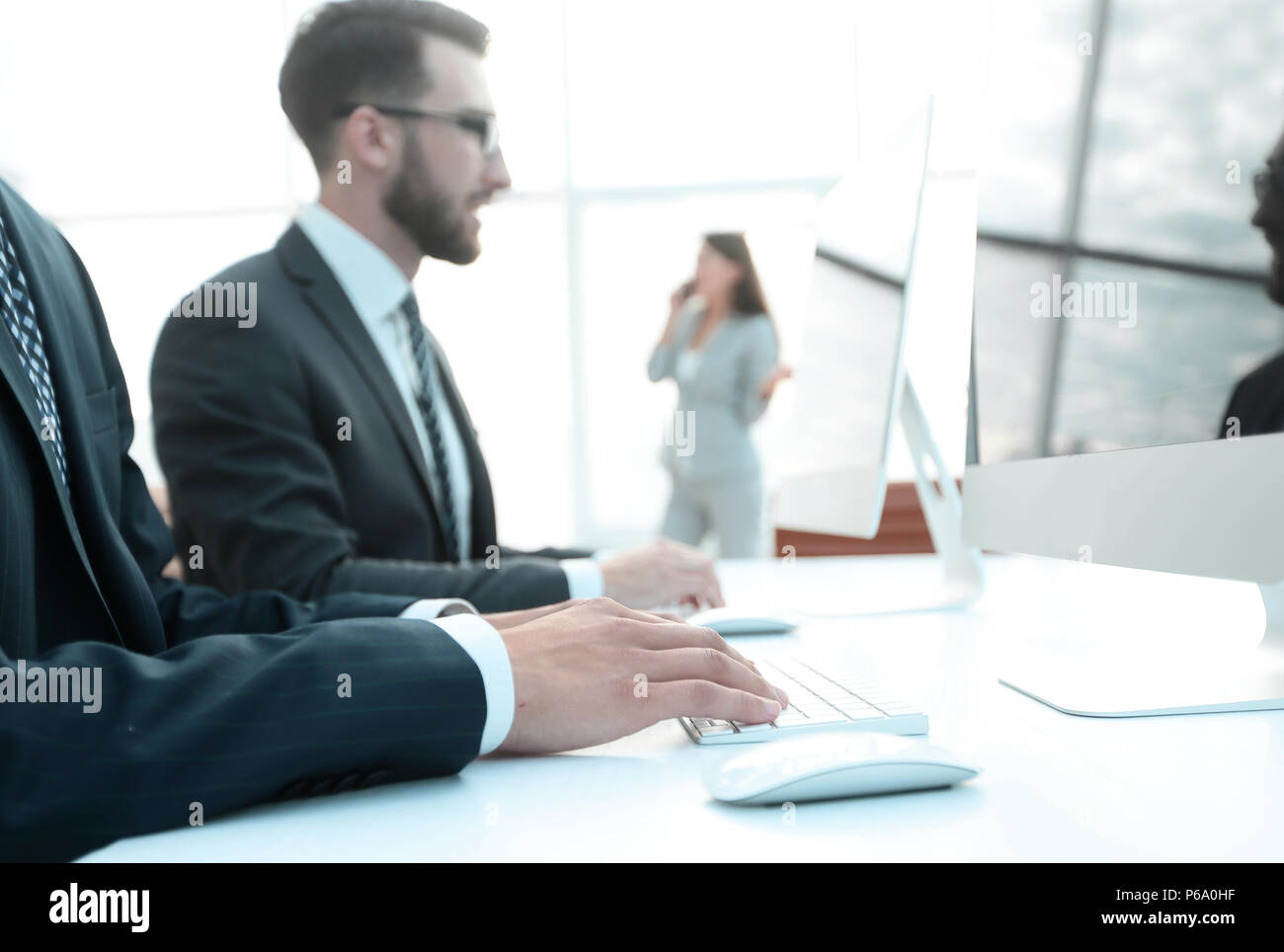 employees working on computers Stock Photo - Alamy