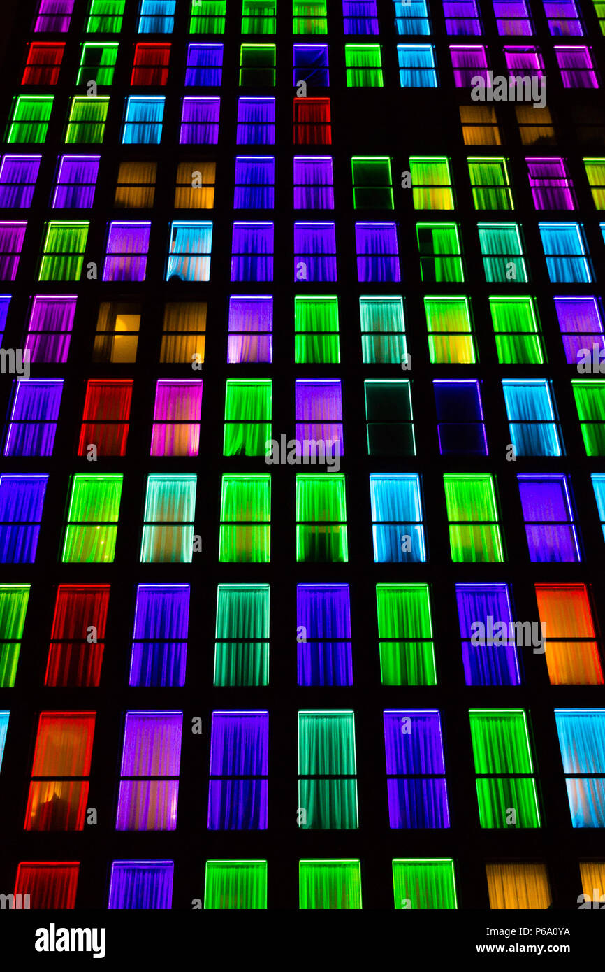 Colored windows texture. Windows illuminated by neon lights background ...