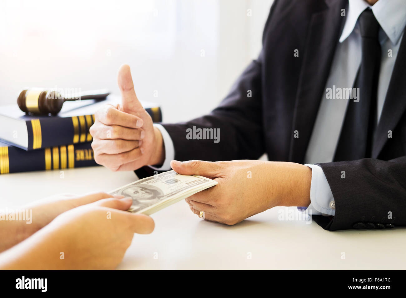 Lawyer receiving money as bribe hi-res stock photography and images - Alamy