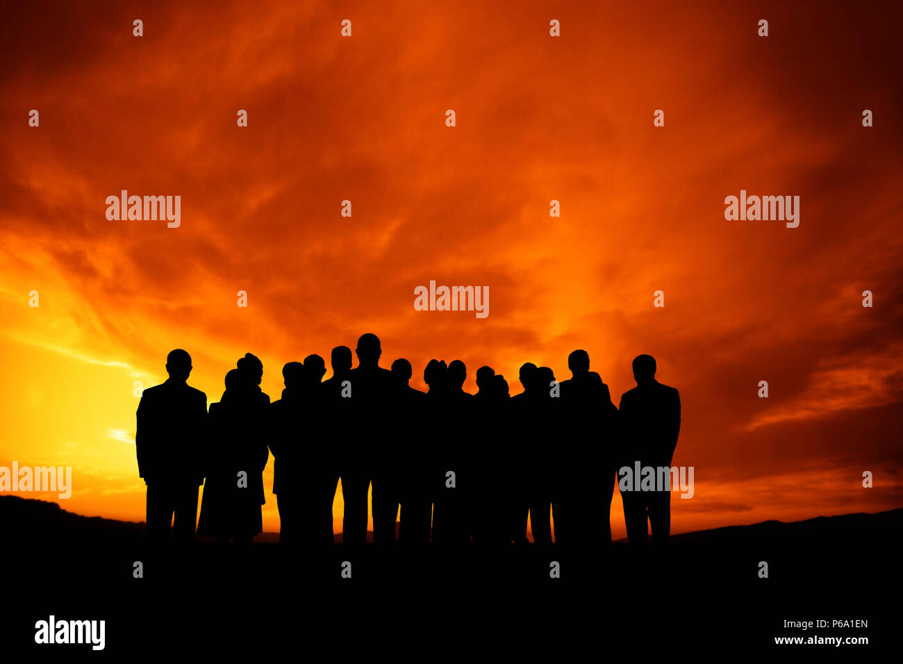 an image of a group of people at sunset Stock Photo - Alamy