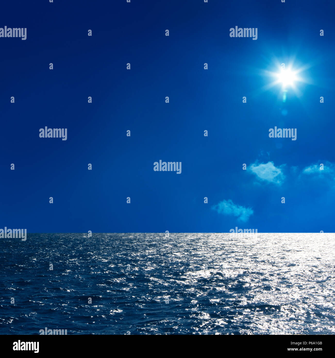 a background image of an open sea and blue sky Stock Photo - Alamy