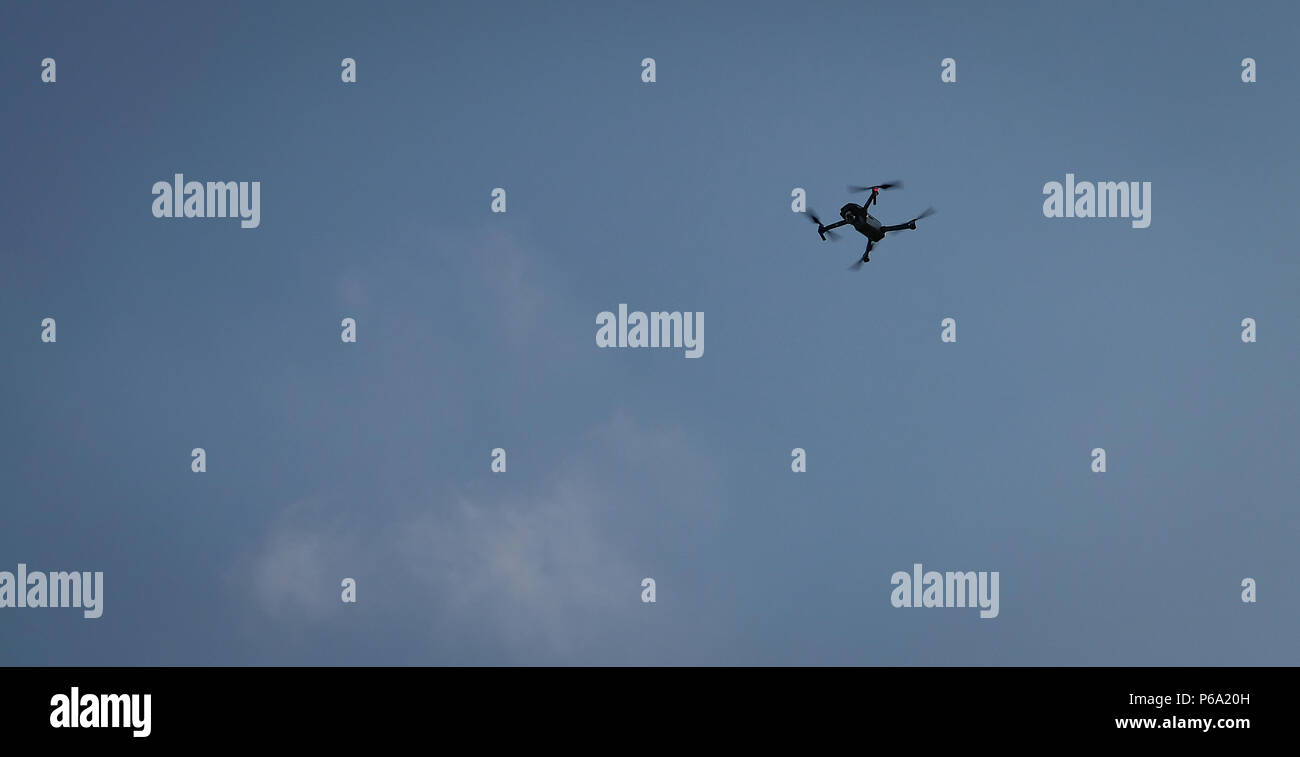 Drone filming flying against sky hi-res stock photography and images ...