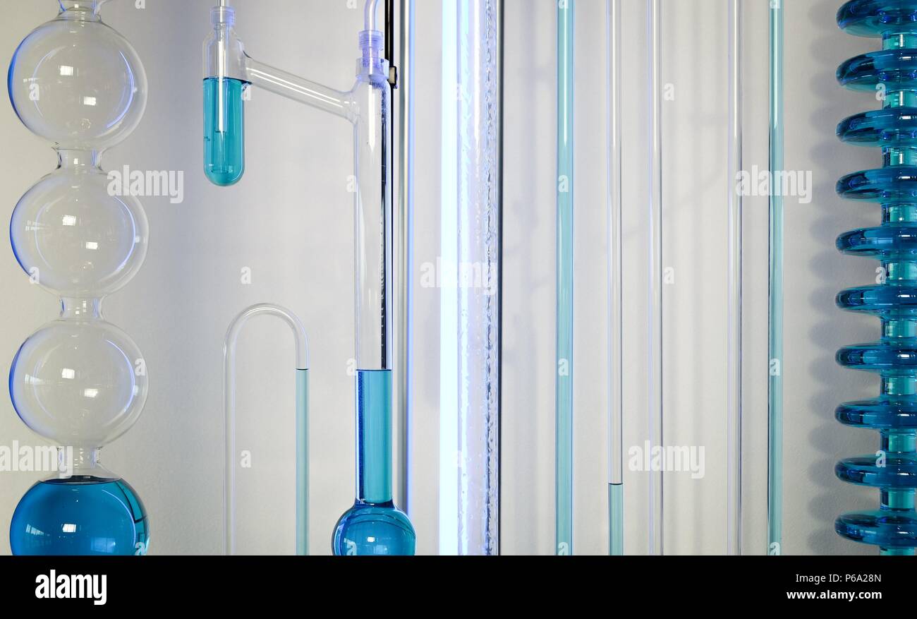 Glass pipes with blue liquid acting as a fluid clock Stock Photo - Alamy