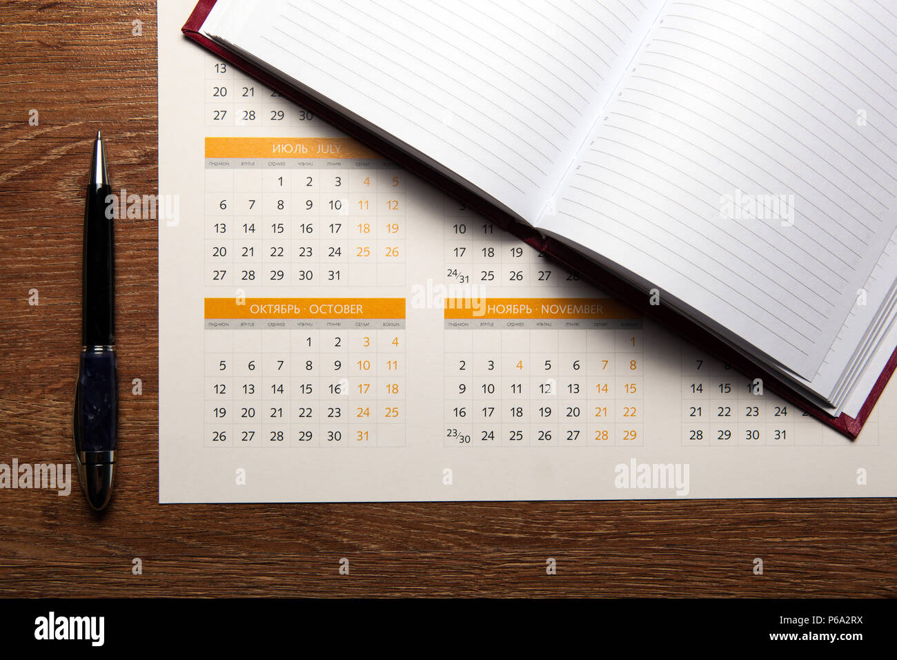 wall calendar with pen and business diary closeup Stock Photo - Alamy