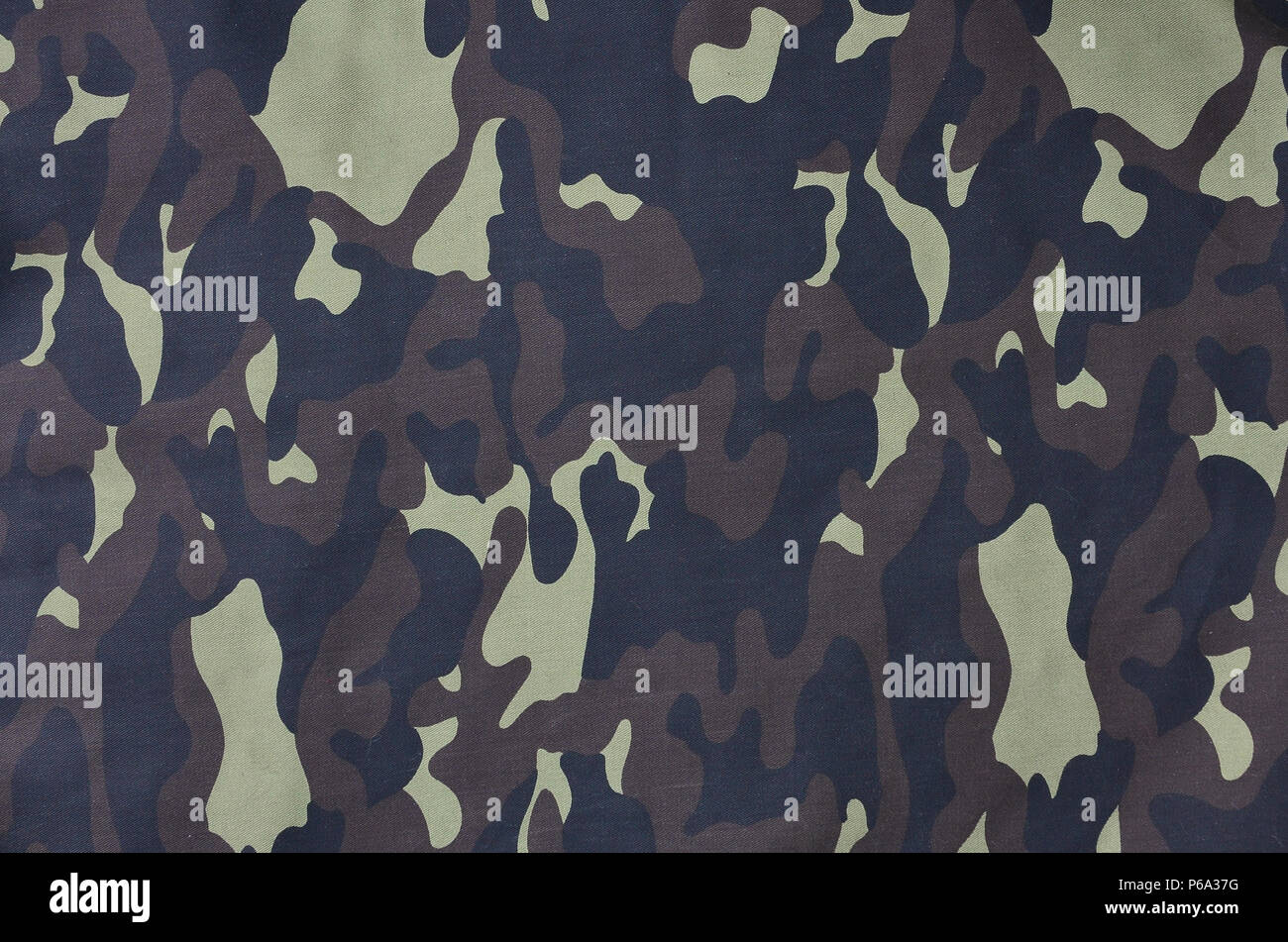Texture of fabric with a camouflage painted in colors of the marsh ...