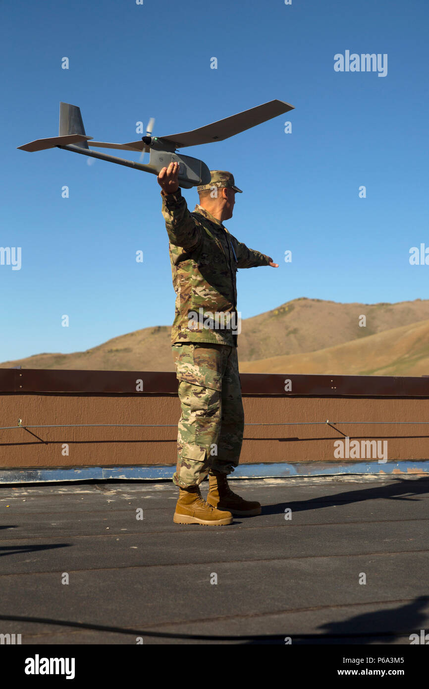 U.S. Army SFC Bradley Godsey demonstrates the steps of launching an ...