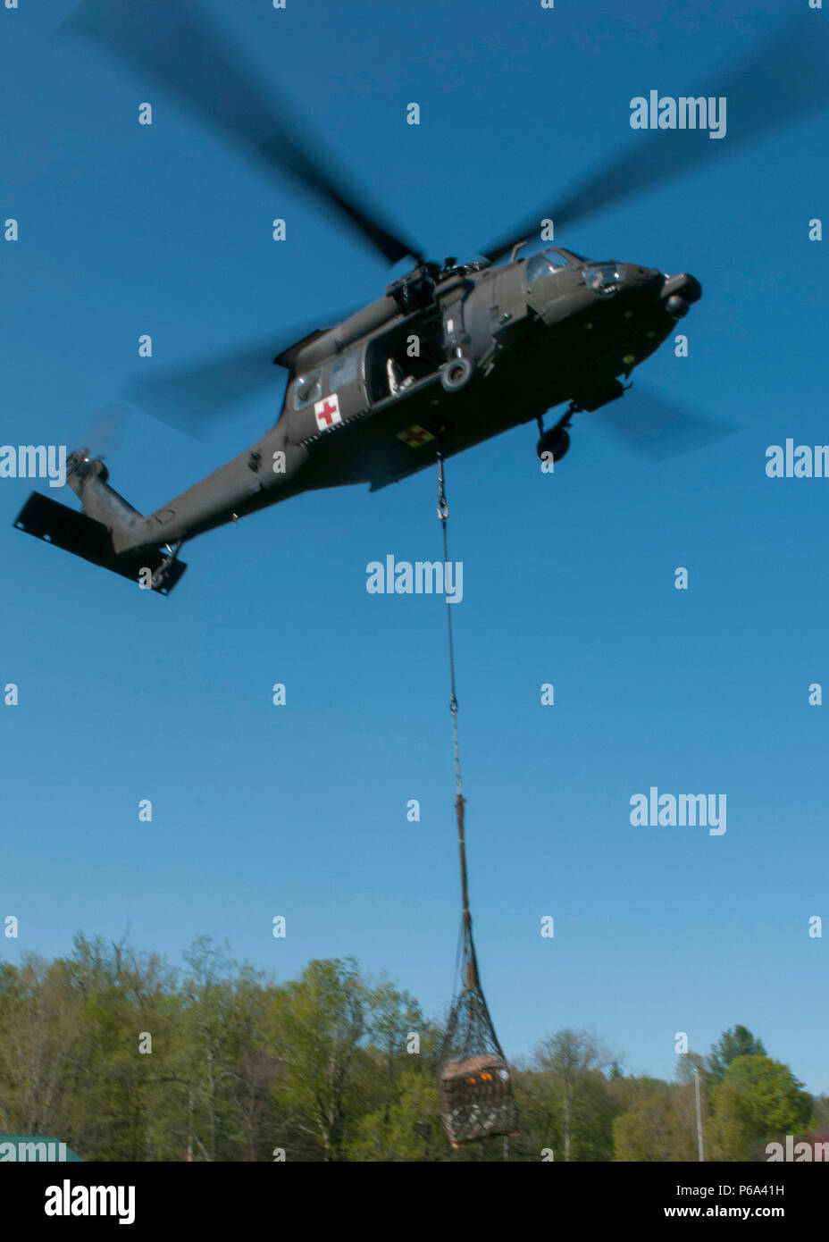 U.S. Soldiers aboard an HH-60M Black Hawk helicopter, assigned to ...
