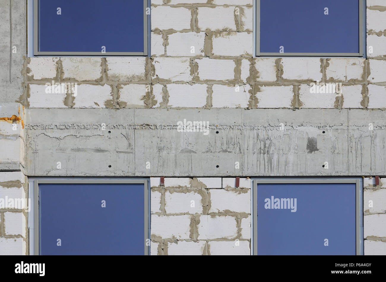 Fragment of an unfinished structure of a multi-storey building made of ...