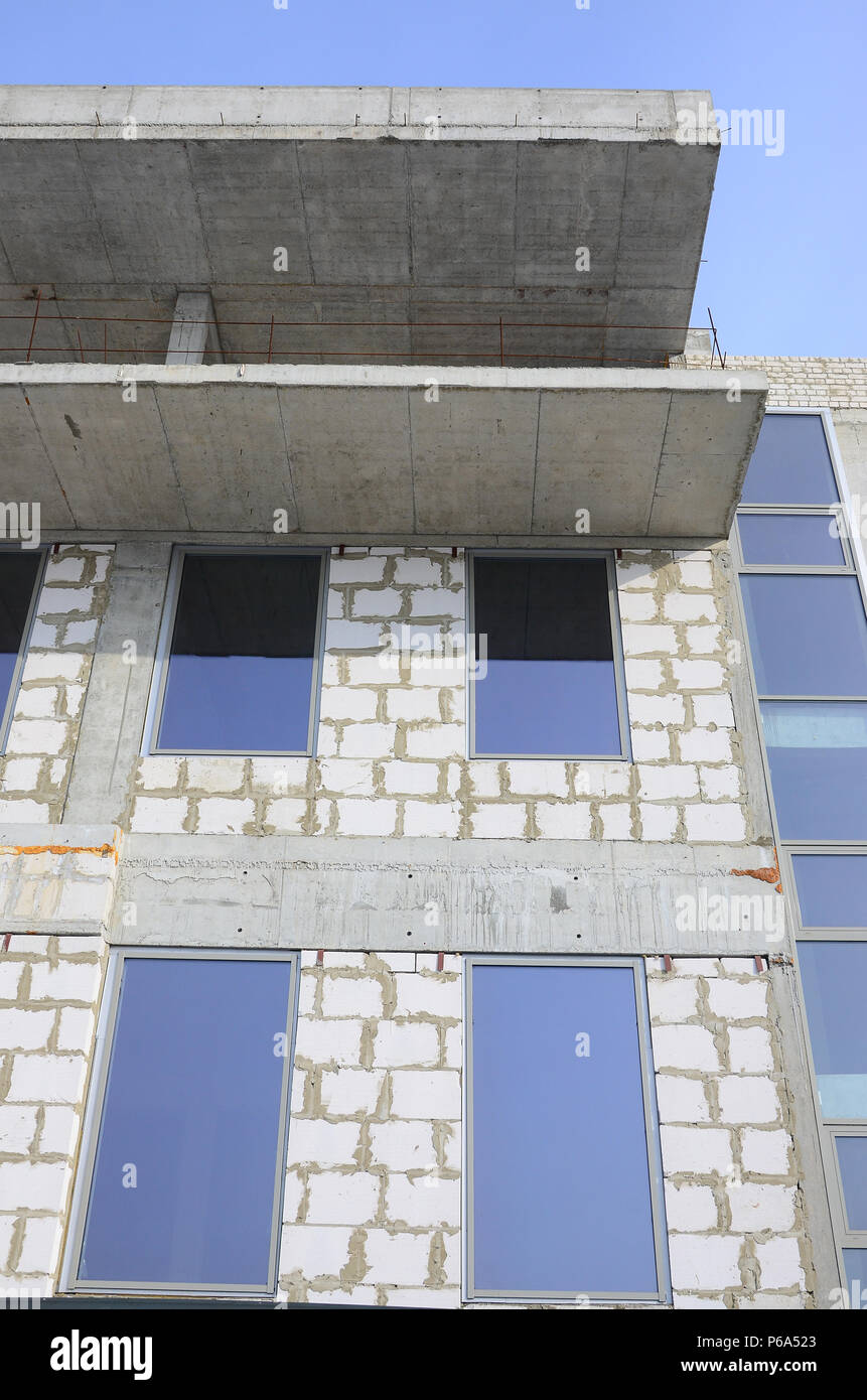 Fragment of an unfinished structure of a multi-storey building made of ...
