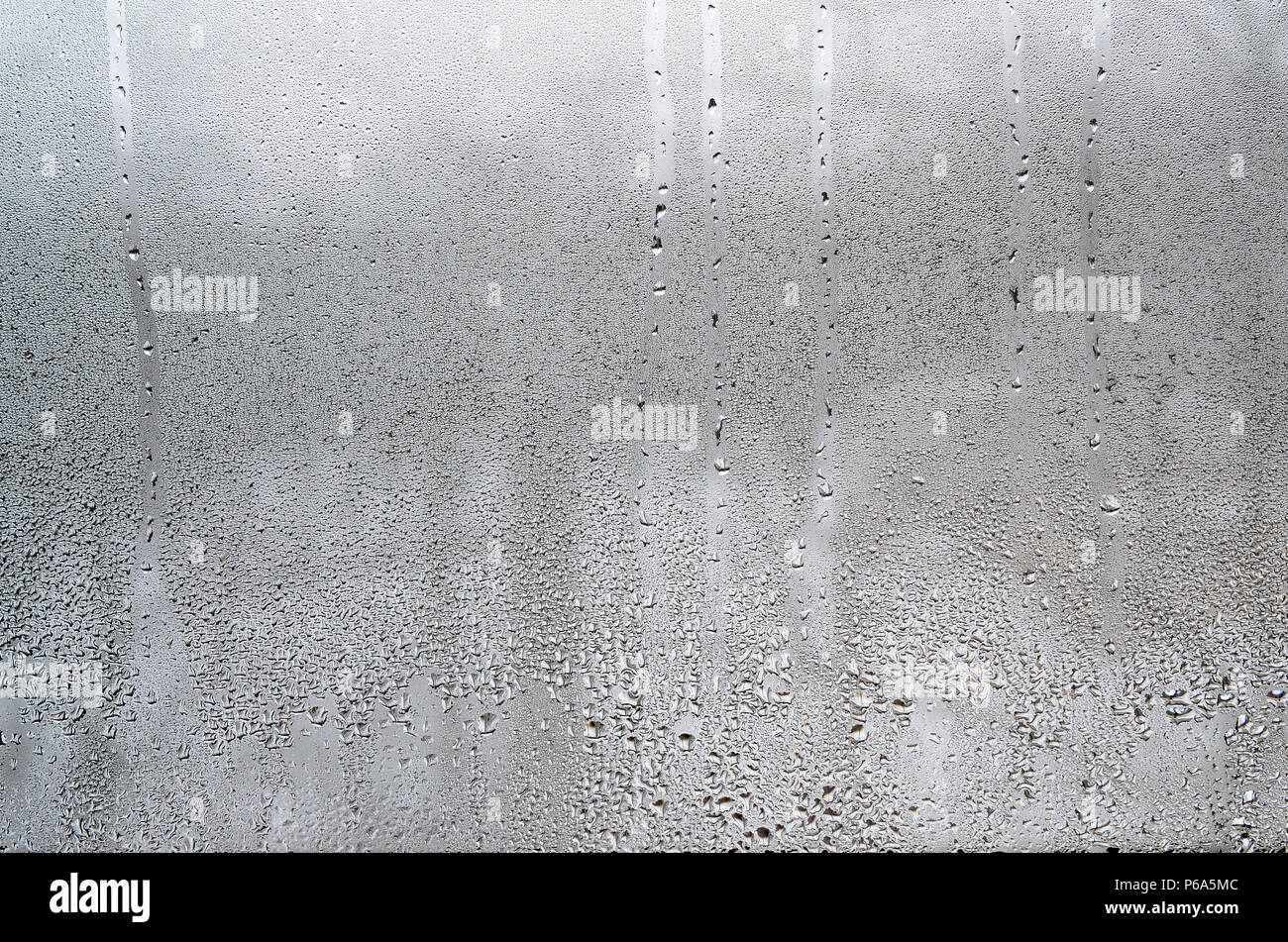 Texture of a drop of rain on a glass wet transparent background. Toned ...