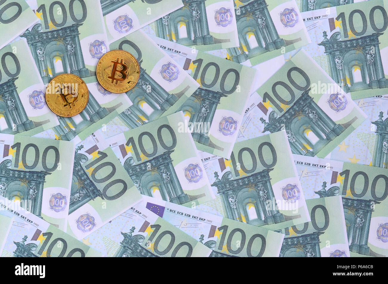 Golden physical bitcoins is lies on a set of green monetary ...