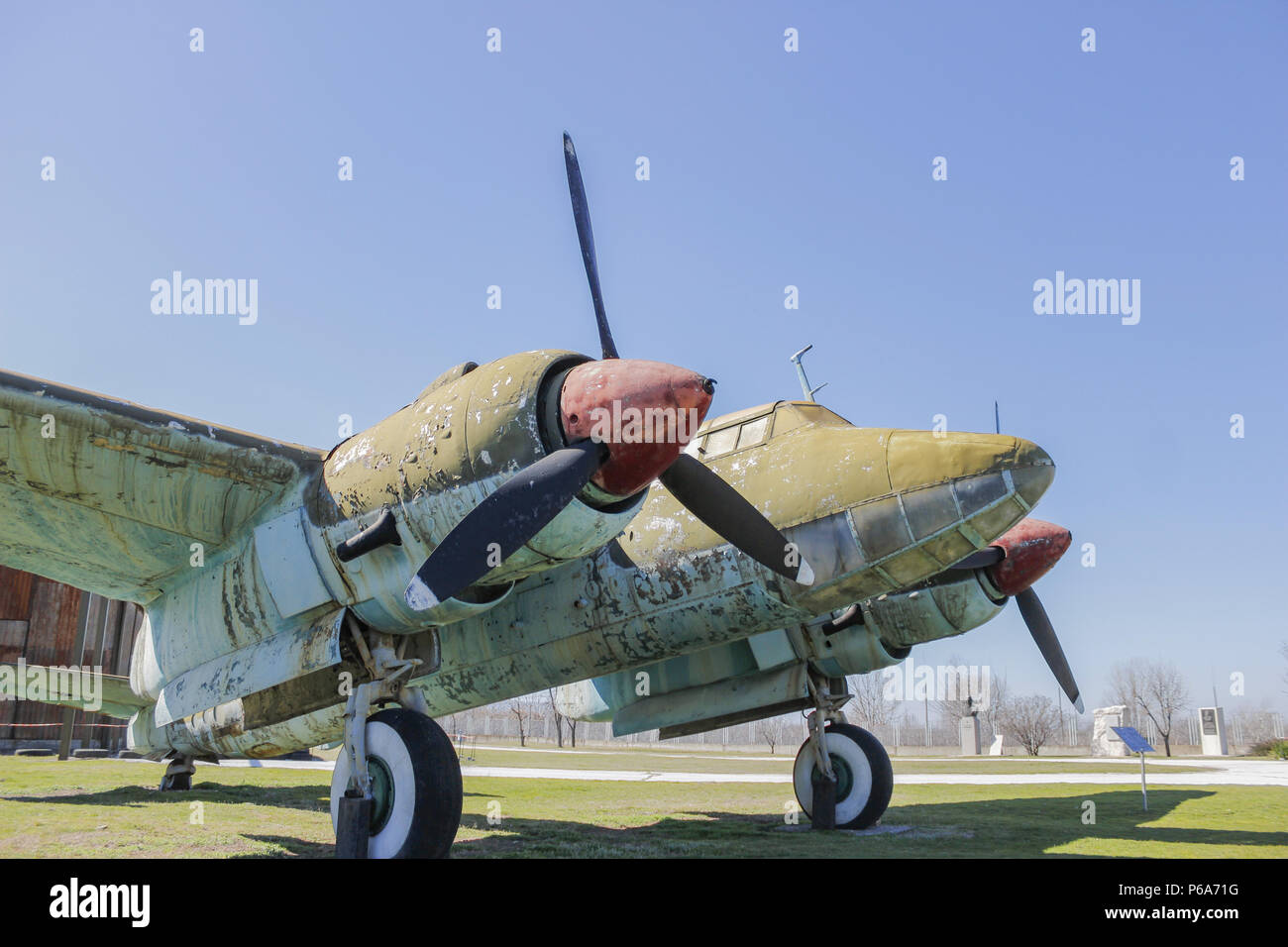 Old Rusty War plane in open air museum during a blue sky sunny day ...