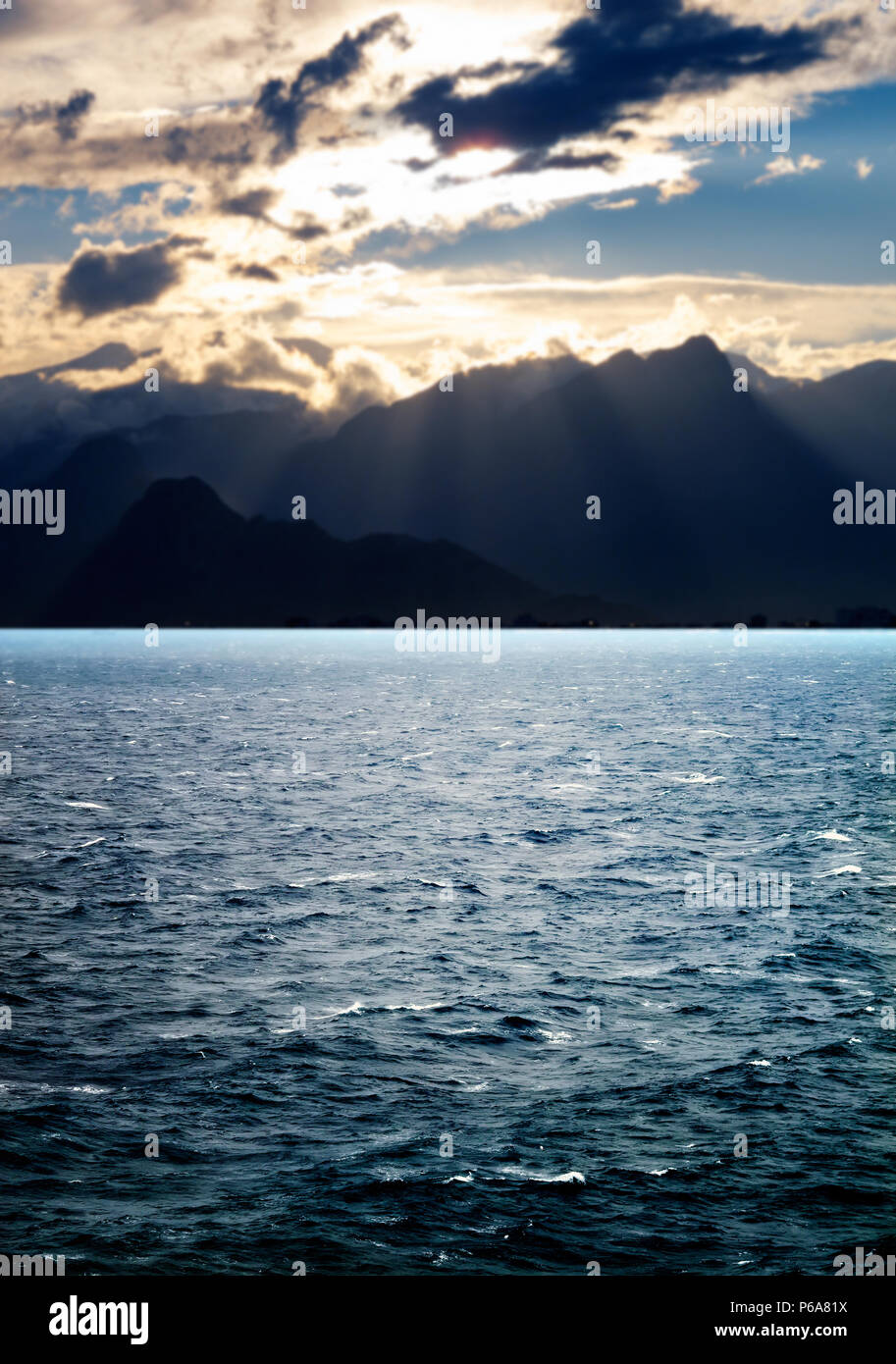 Dramatic clouds and sunlight during stormy weather over ocean hi-res ...