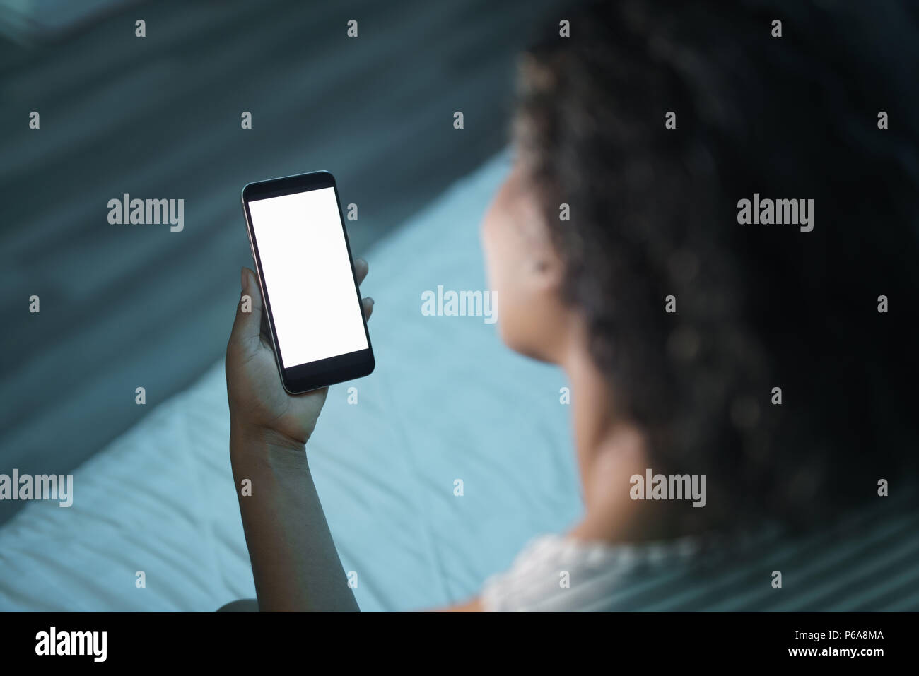African american woman watching smartphone hi-res stock photography and ...