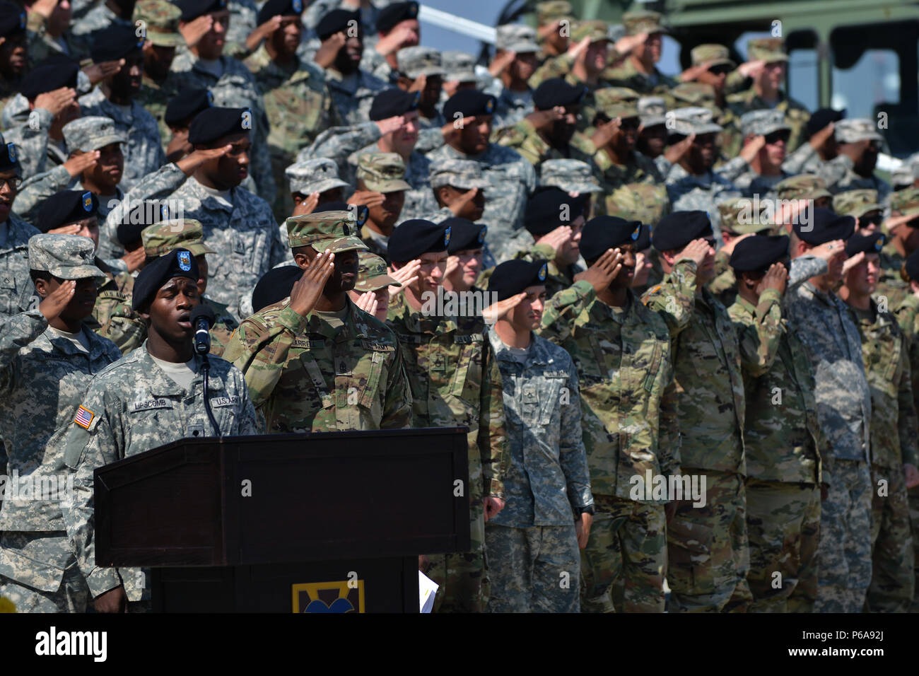 Members of the 7th Transportation Brigade (Expeditionary) salute as the ...