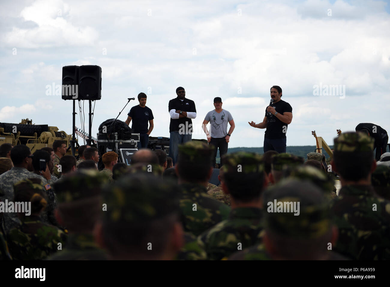 U.S. and Romanian troops watch a USO show at the Cincu Training Area ...