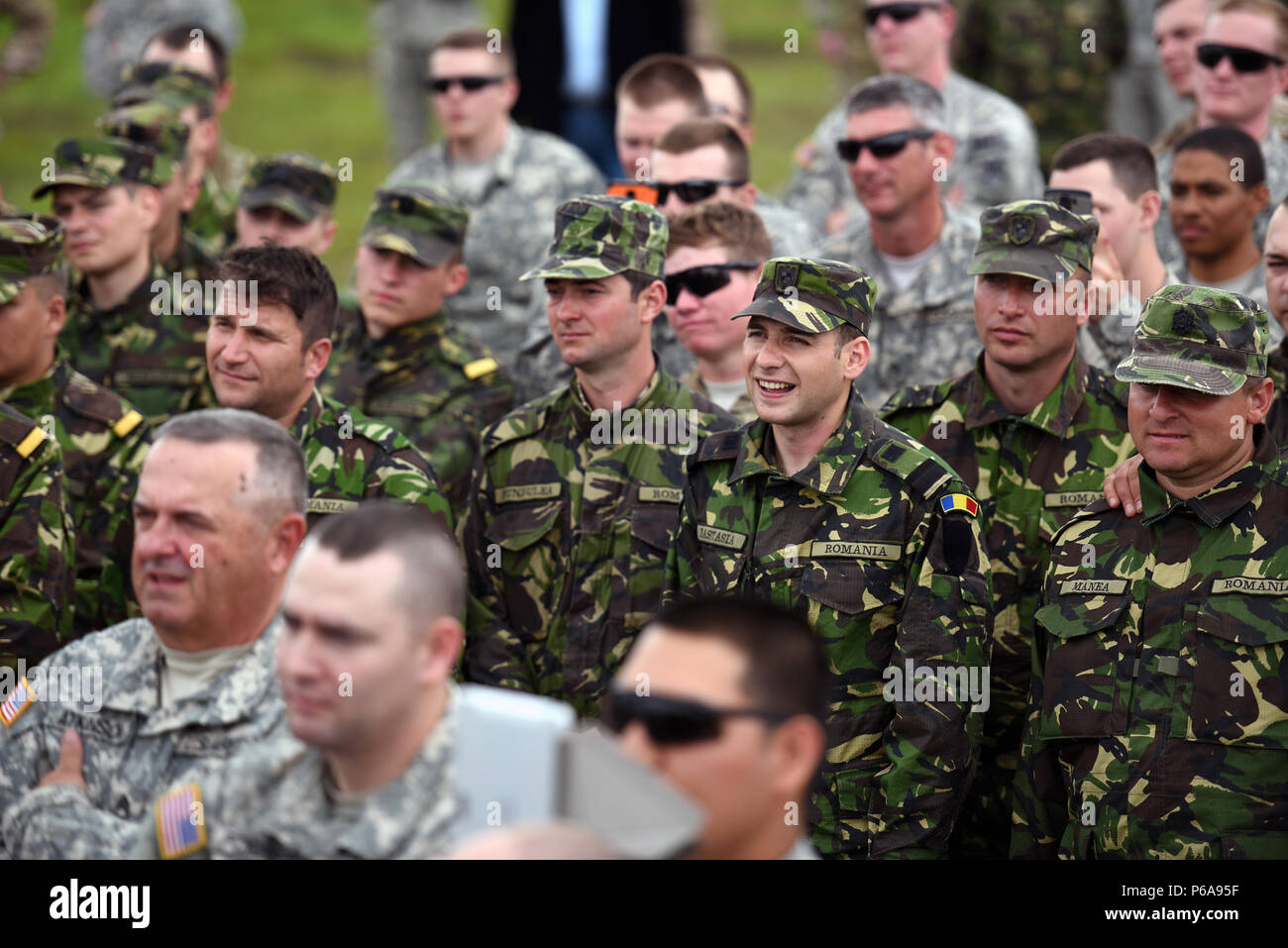 U.S. and Romanian troops enjoy a USO show at the Cincu Training Area ...