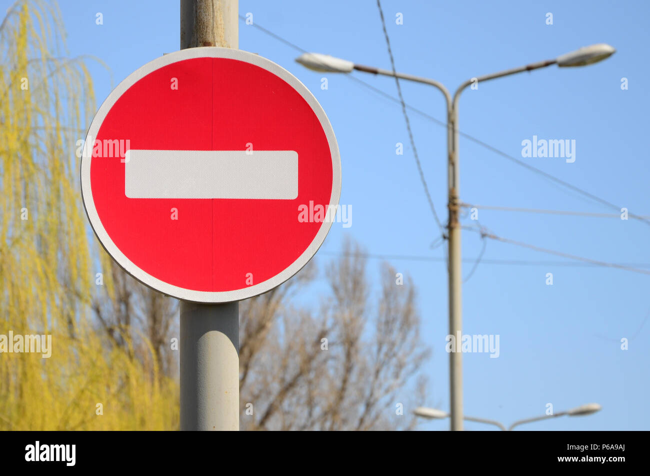 Road sign in the form of a white rectangle in a red circle. No entry ...