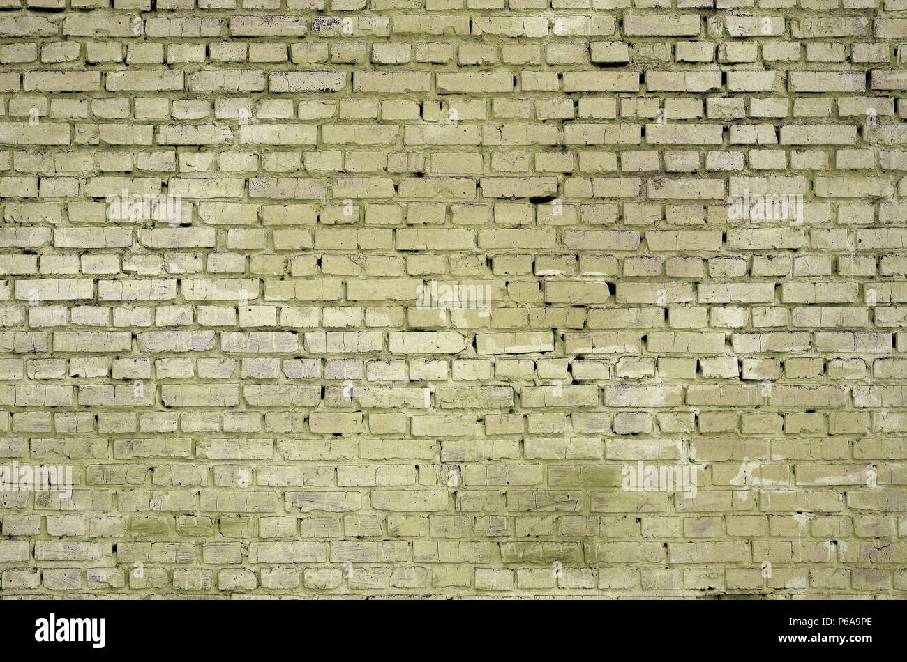Square brick block wall background and texture. Painted in yellow Stock ...