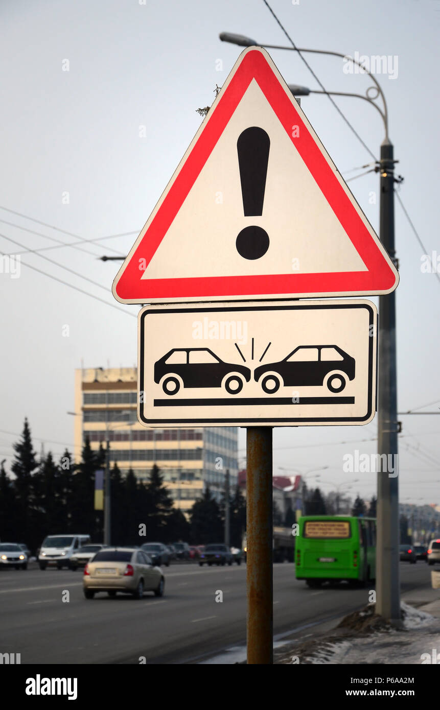 High risk of collision. A road sign with an exclamation point and two ...