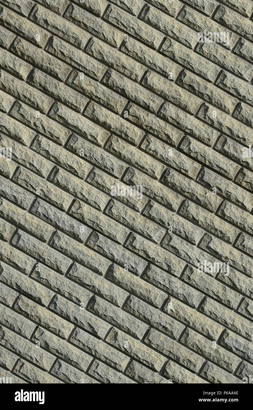 The texture of the wall is made of modern relief brown brick ...