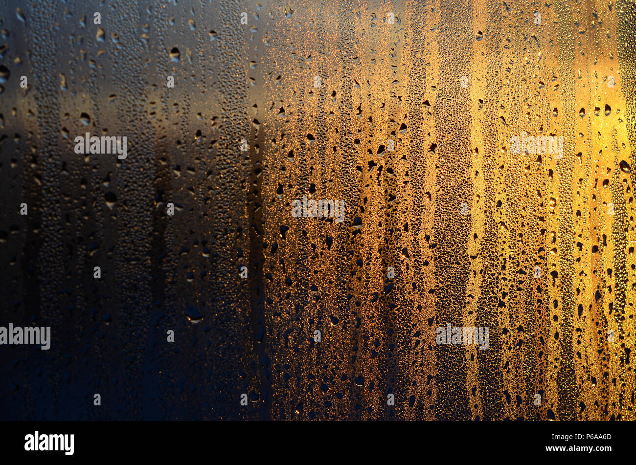 The texture of misted glass with a lot of drops and drips of ...
