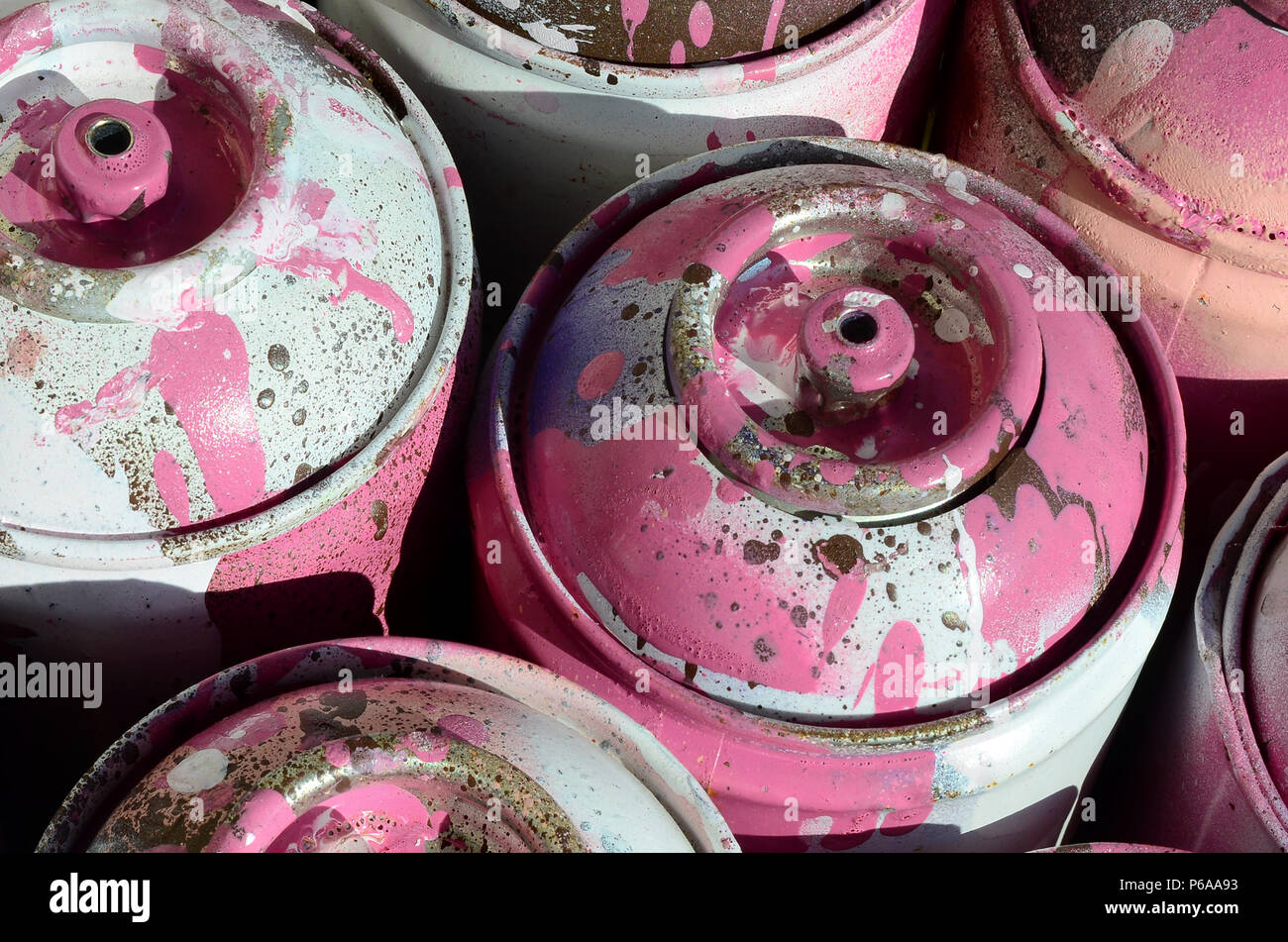 A lot of used pink metal tanks with paint for drawing graffiti Stock ...