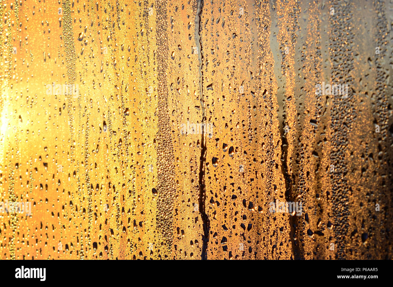 The texture of misted glass with a lot of drops and drips of ...