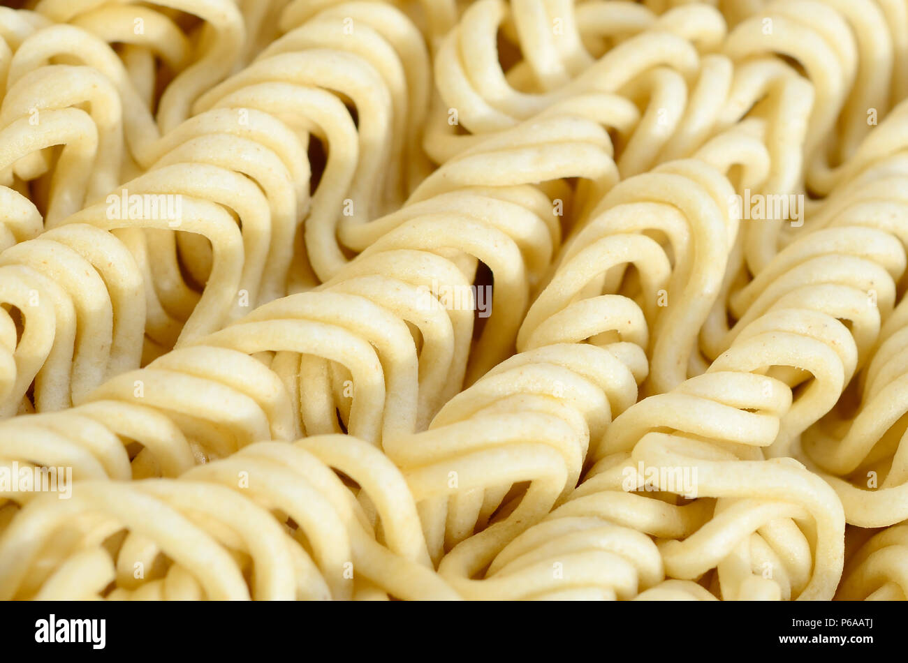 Close up view of yellow dry instant noodles. Chinese traditional food ...
