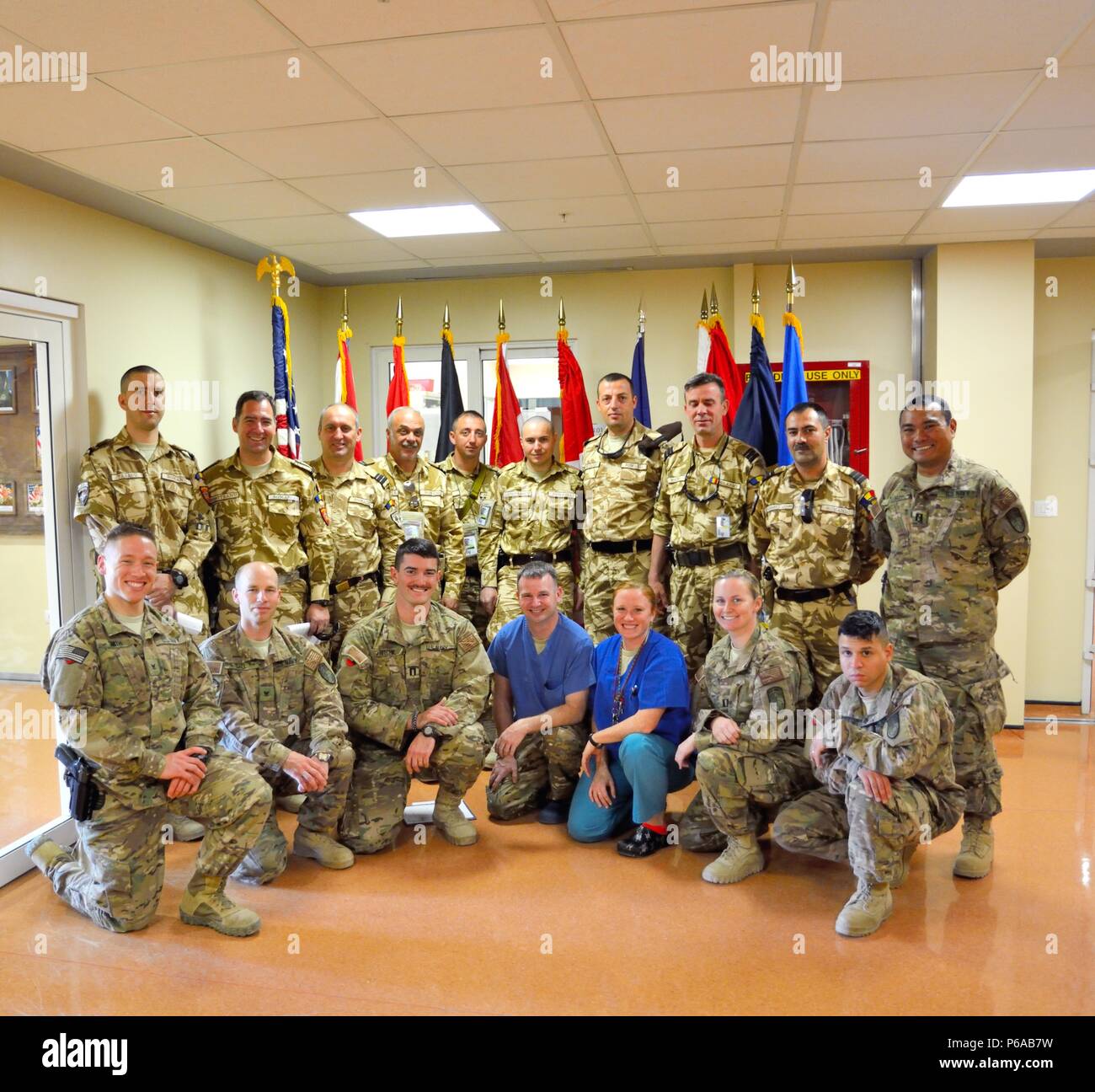 A U.S. Navy nurse and corpsman collaborate with Romanian forces at a ...
