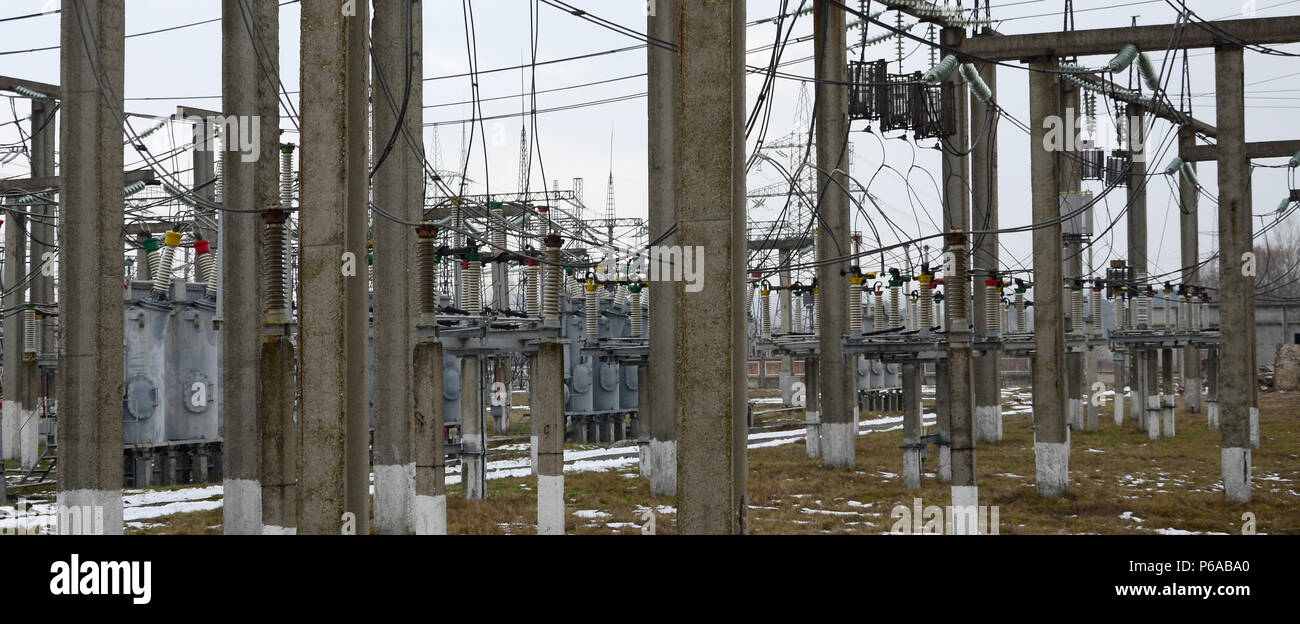 Power plant is a station of transformation. A lot of cables, poles and ...