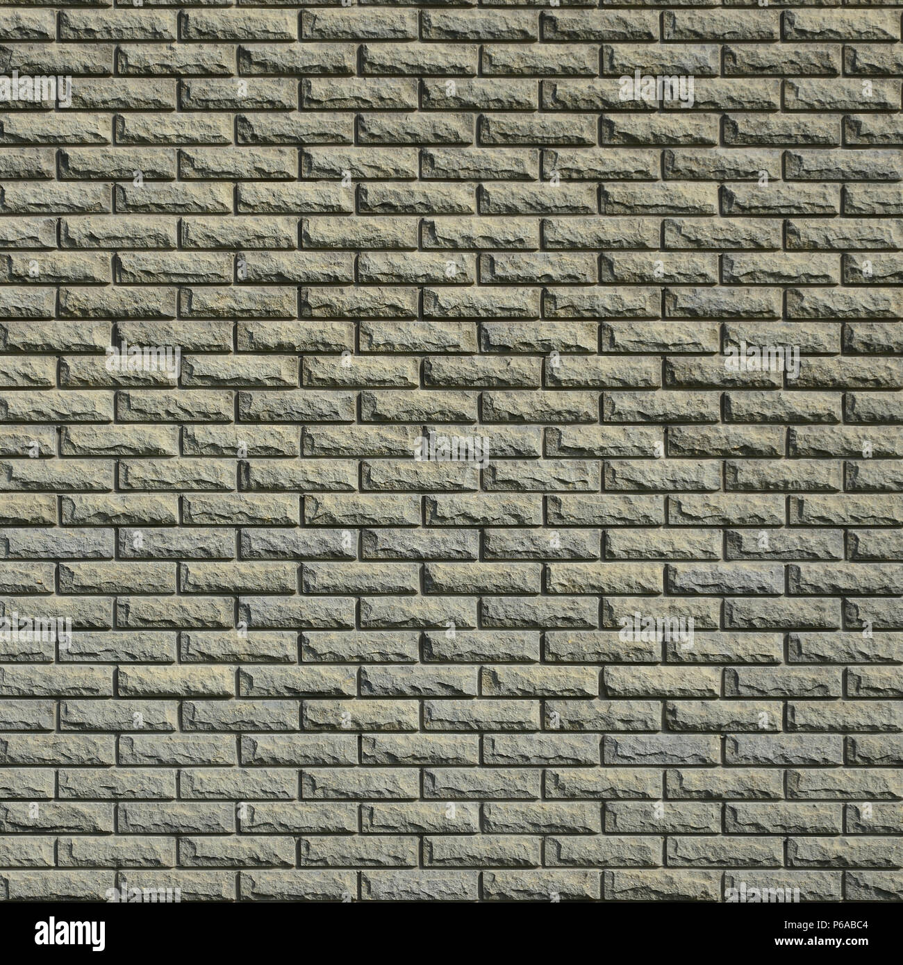 The texture of the wall is made of modern relief brown brick ...