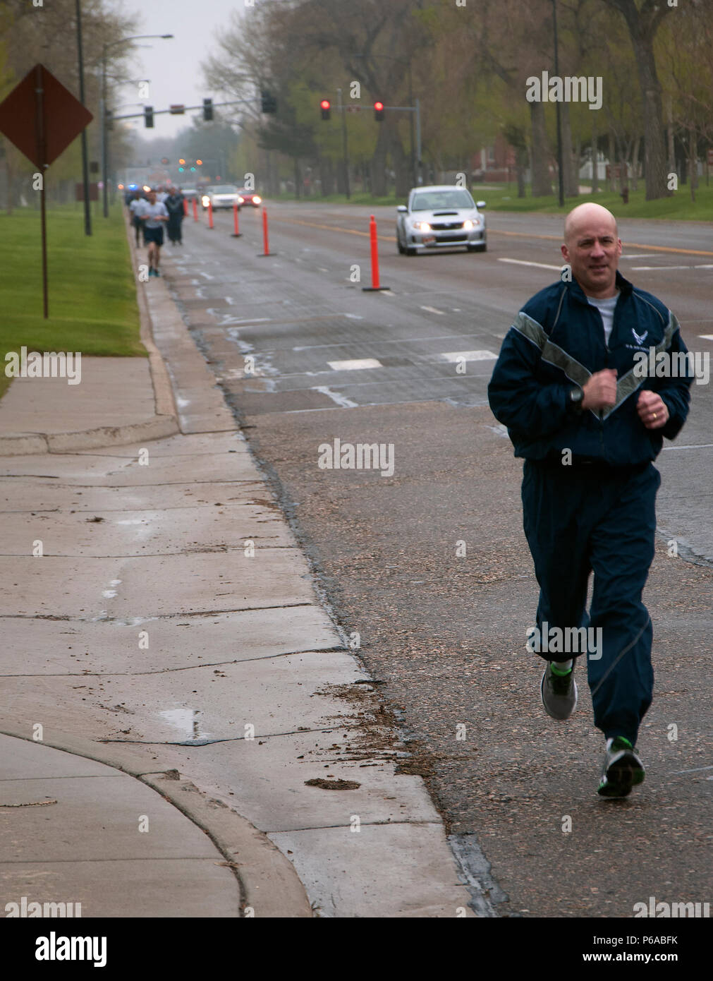 Col. Christopher Corley, 90th Security Forces Group commander, runs ...