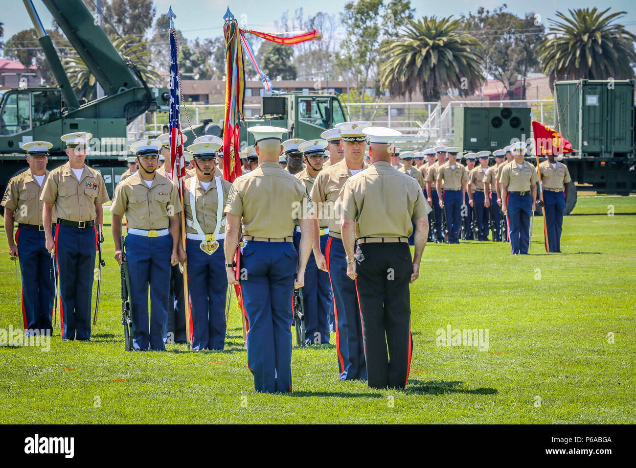 U.S. Marines with the 1st Marine Logistics Group gather for a change of ...