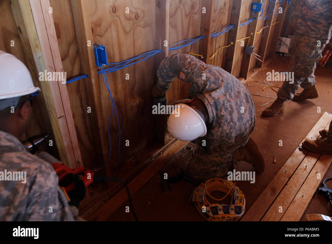 Spc. Sunil Basnet, carpentry and masonry specialist (left) and Spc ...