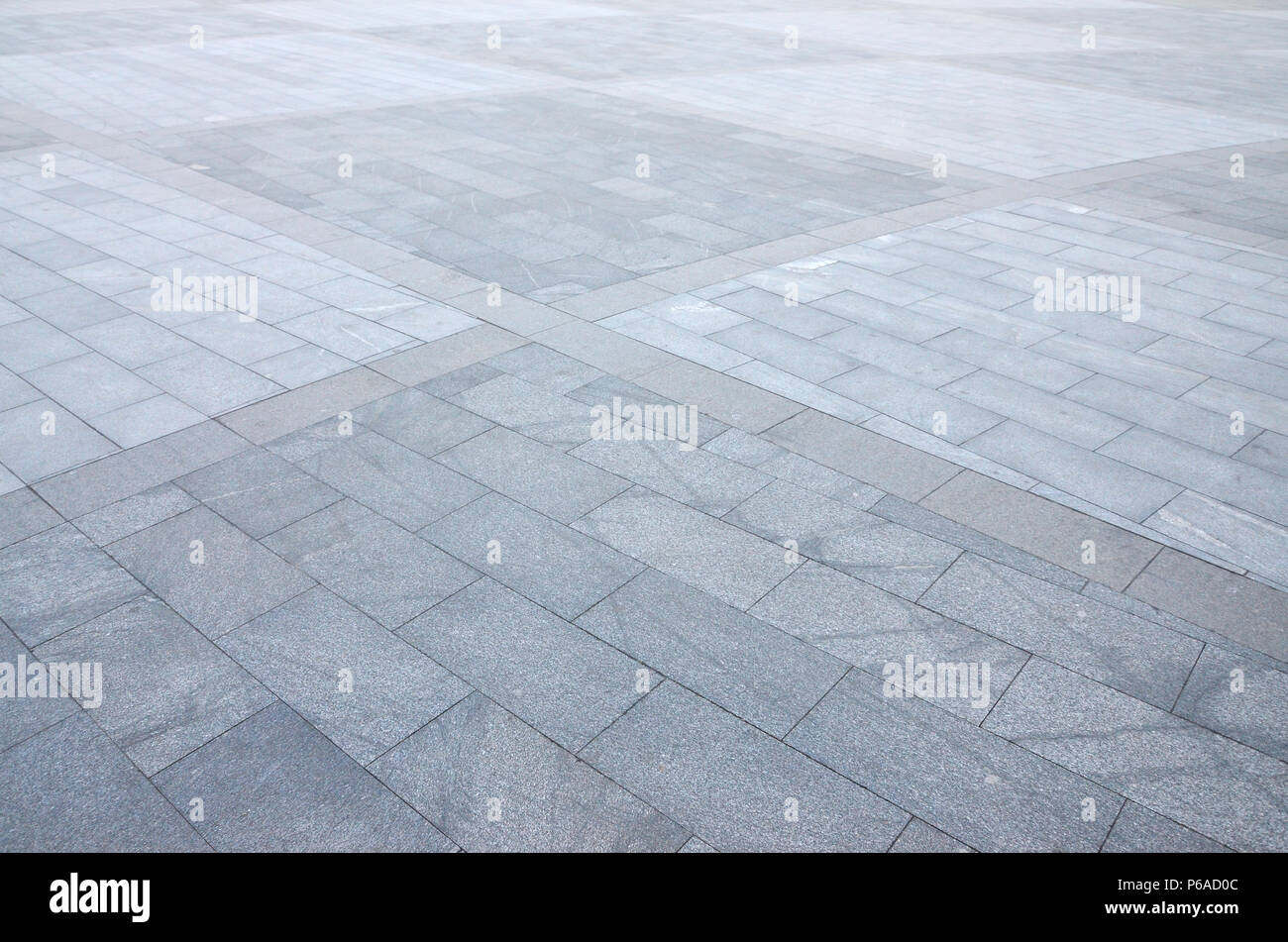 Fragment of the square paved of a large granite tiles Stock Photo - Alamy