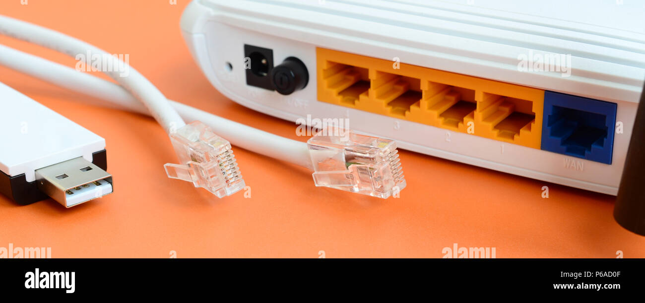 Internet router, portable USB wi-fi adapter and internet cable plugs ...