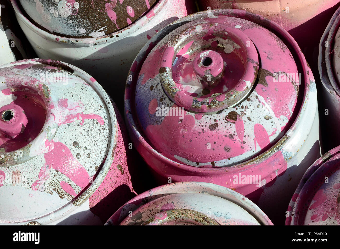 A lot of used pink metal tanks with paint for drawing graffiti Stock ...