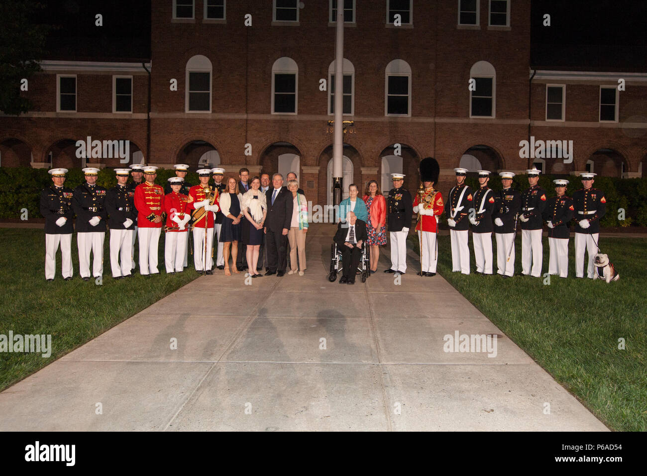 U.S. Marines and guests of the evening parade pose for a photo at ...