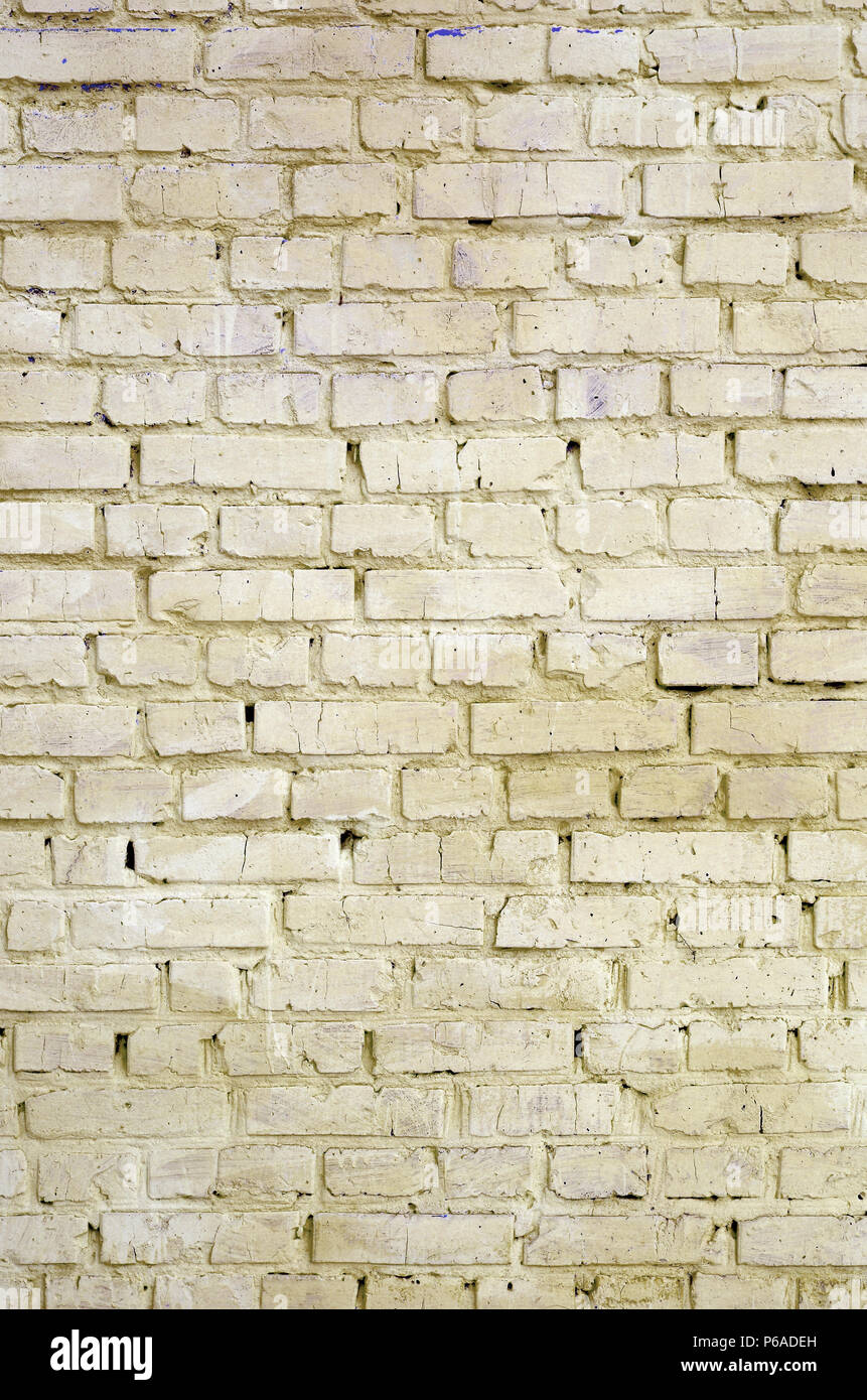 Square brick block wall background and texture. Painted in yellow Stock ...