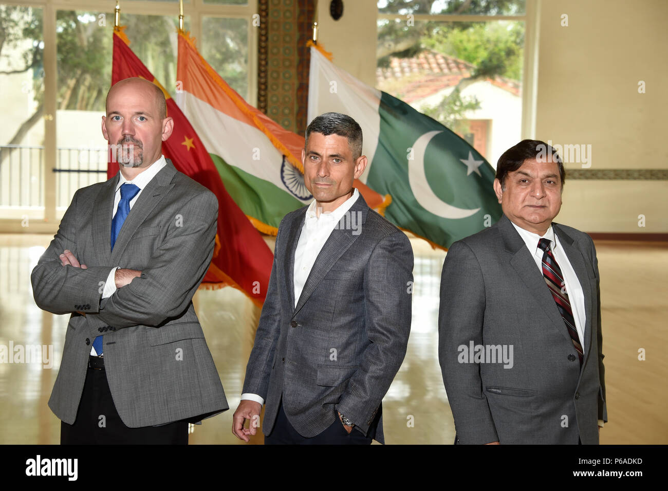 NPS Professors Christopher Twomey, left, and Paul Kapur, center, with ...