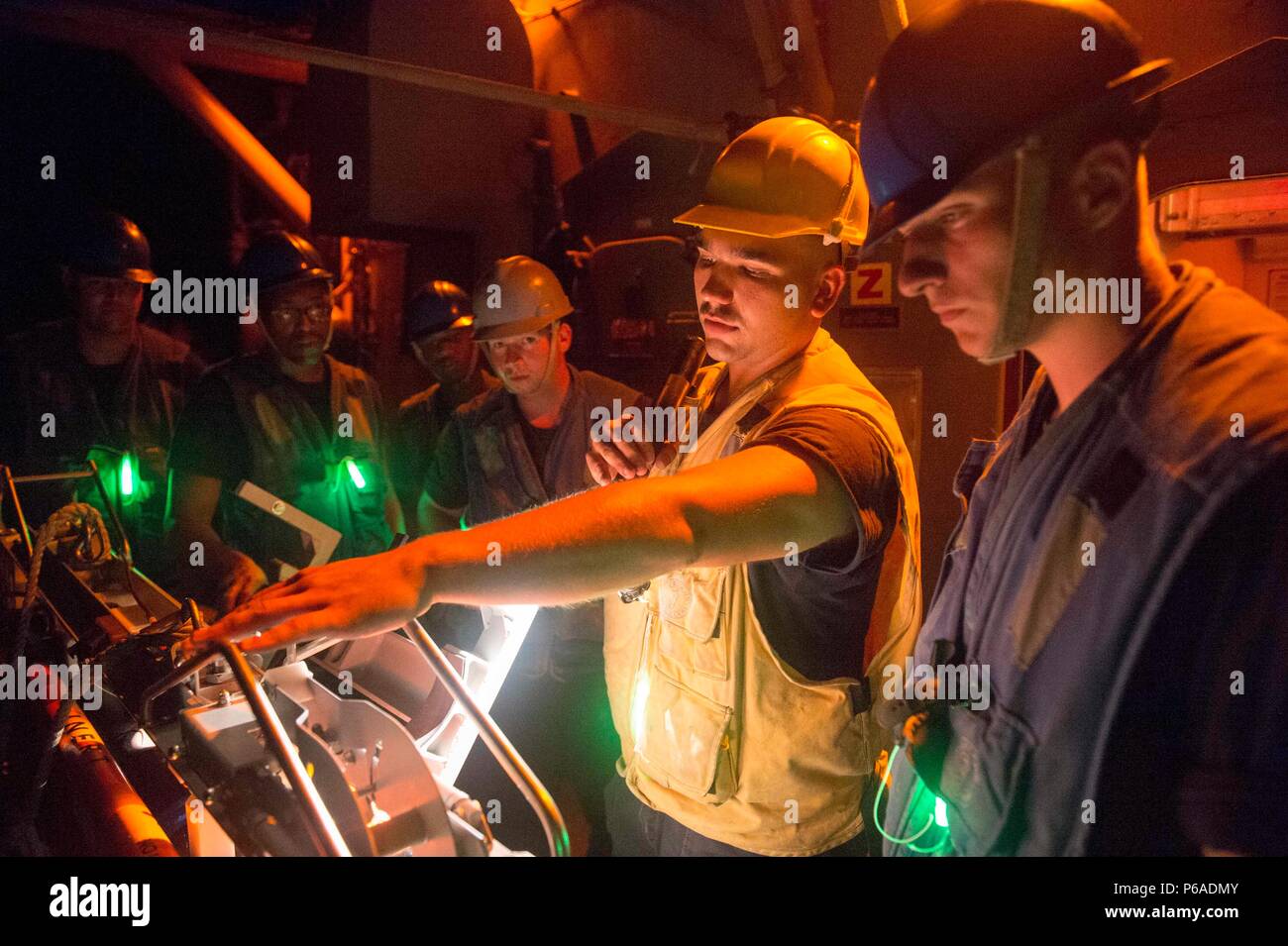 Mineman 3rd Class Kevin Lanctot, center, assigned to USS Gladiator (MCM ...