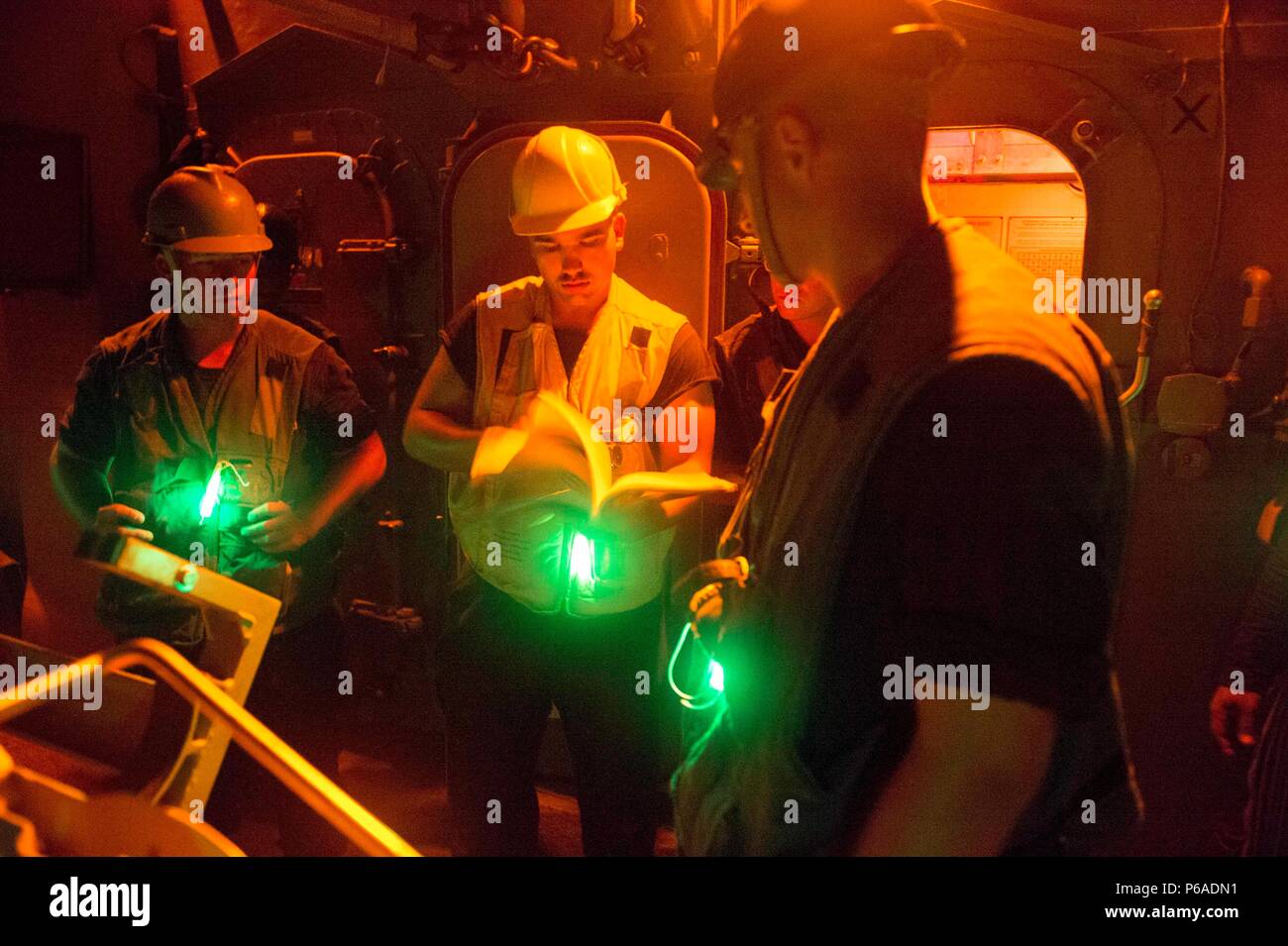 Mineman 3rd Class Kevin Lanctot, center, assigned to USS Gladiator (MCM ...
