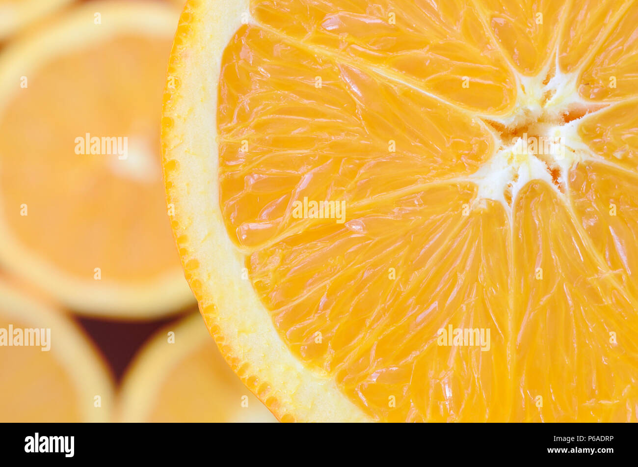 Top view of a fragment of the orange fruit slice on the background of ...