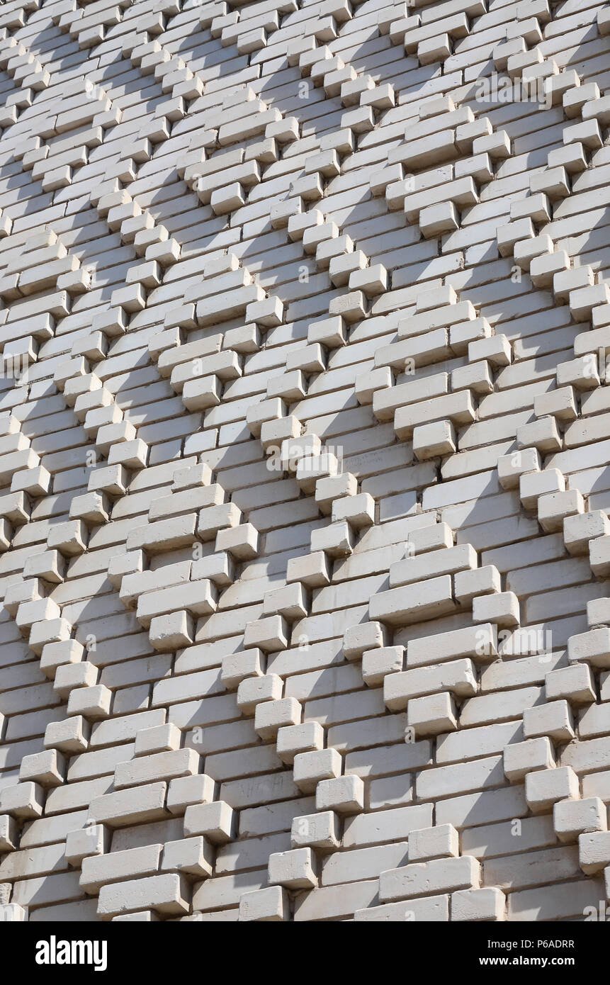 A pattern made of white bricks in the form of diamond shapes ...