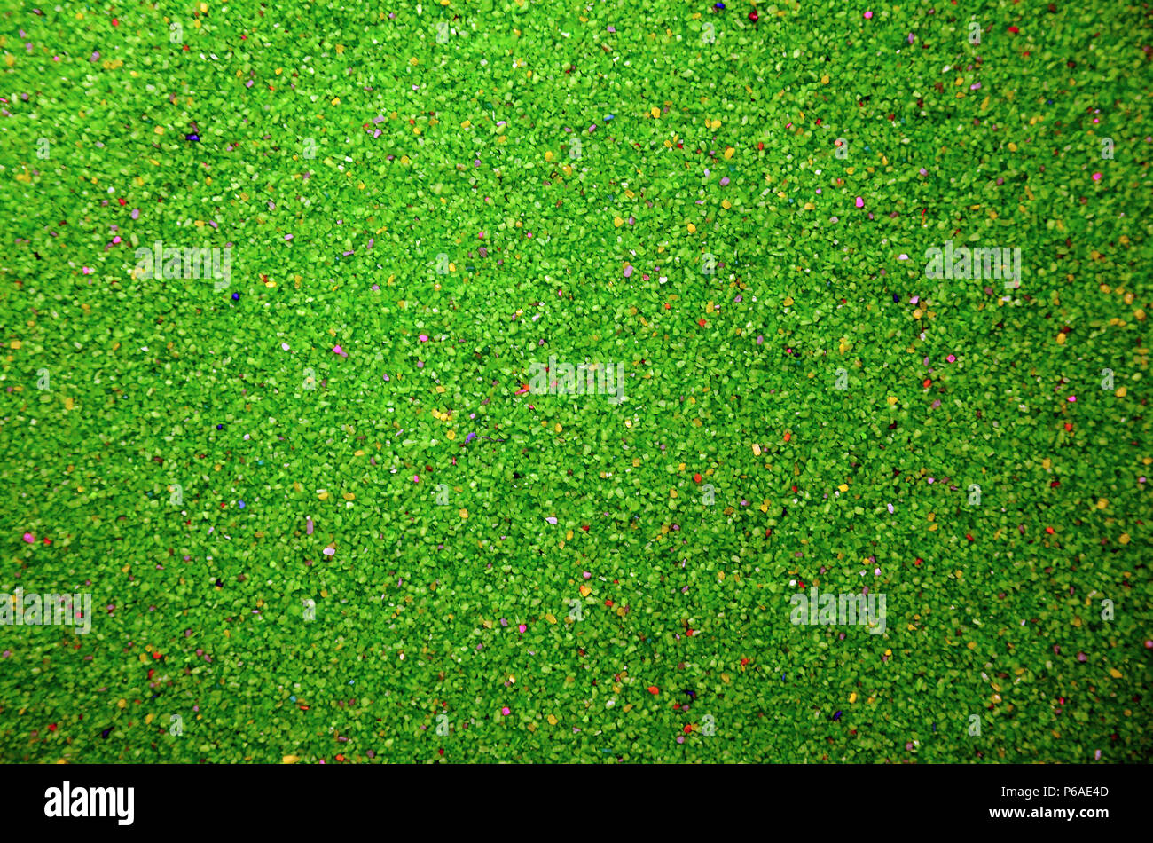 Texture of a colored granular sand close up. Green grains Stock Photo ...