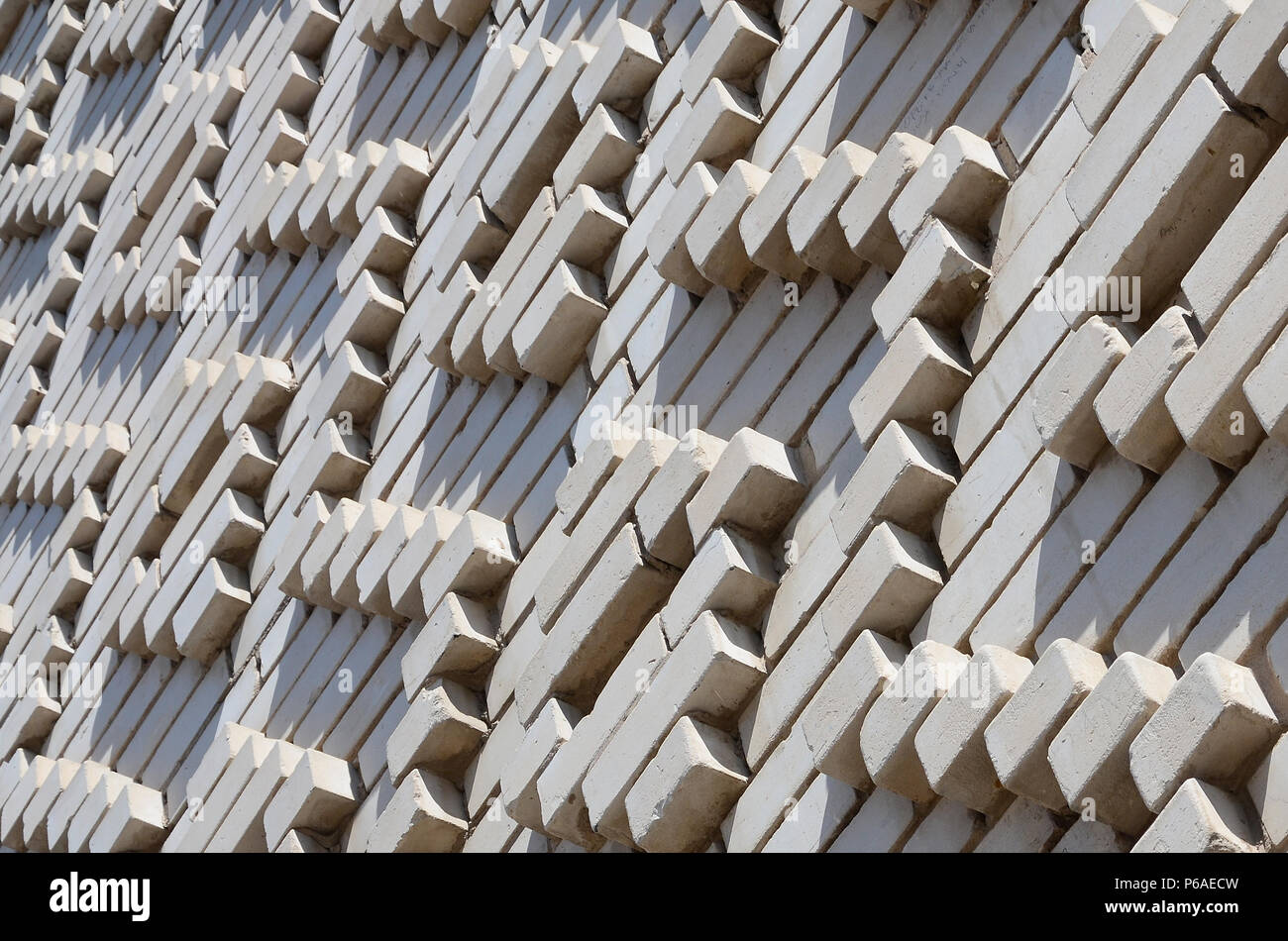 A pattern made of white bricks in the form of diamond shapes ...