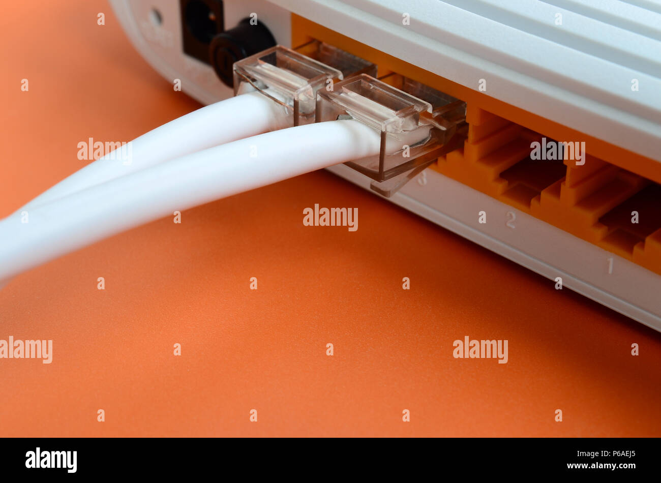 The Internet cable plugs are connected to the Internet router, which ...