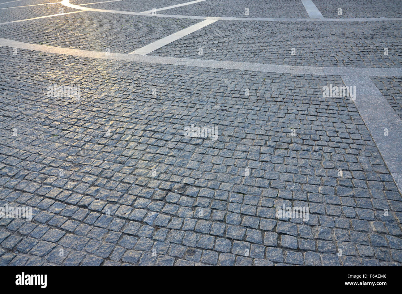 Fragment of the street square, folded out of a gray square paving stone ...