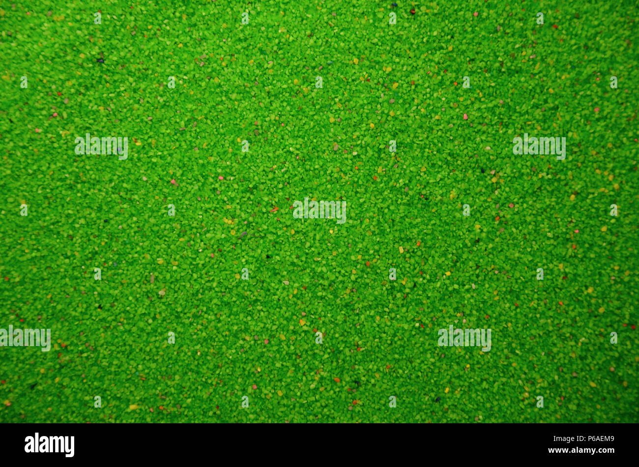 Texture of a colored granular sand close up. Green grains Stock Photo ...